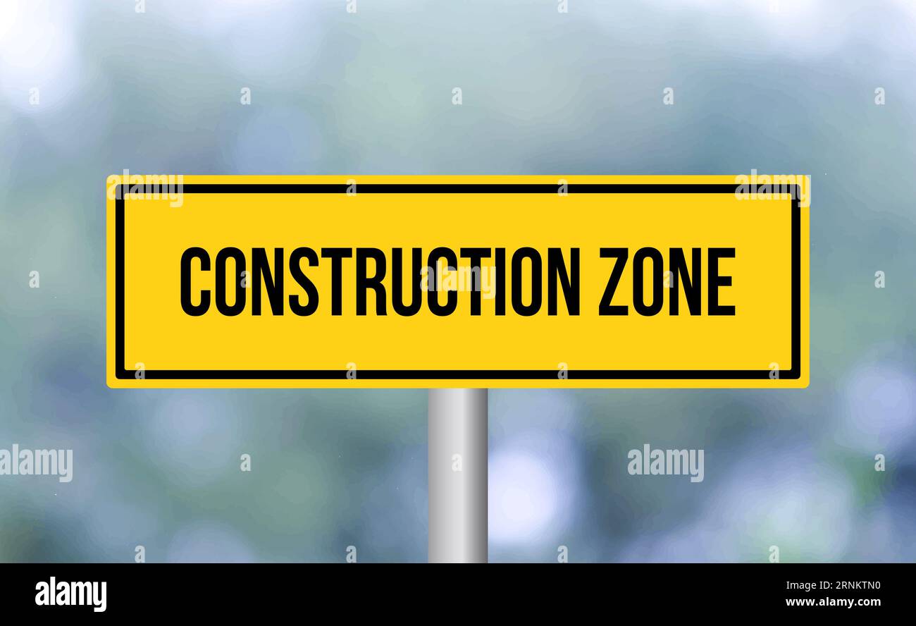 Construction zone road sign on blur background Stock Photo - Alamy