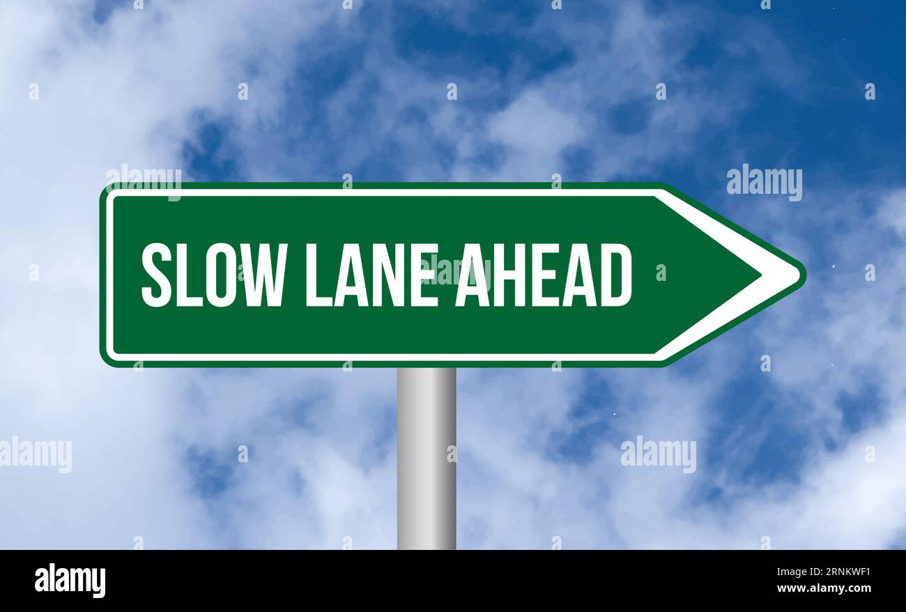 Slow lane ahead road sign on cloudy sky background Stock Photo - Alamy