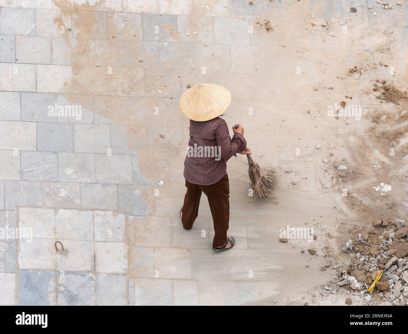 Female street sweeper working at Sam Son Beach, Thanh Hoa, Vietnam ...