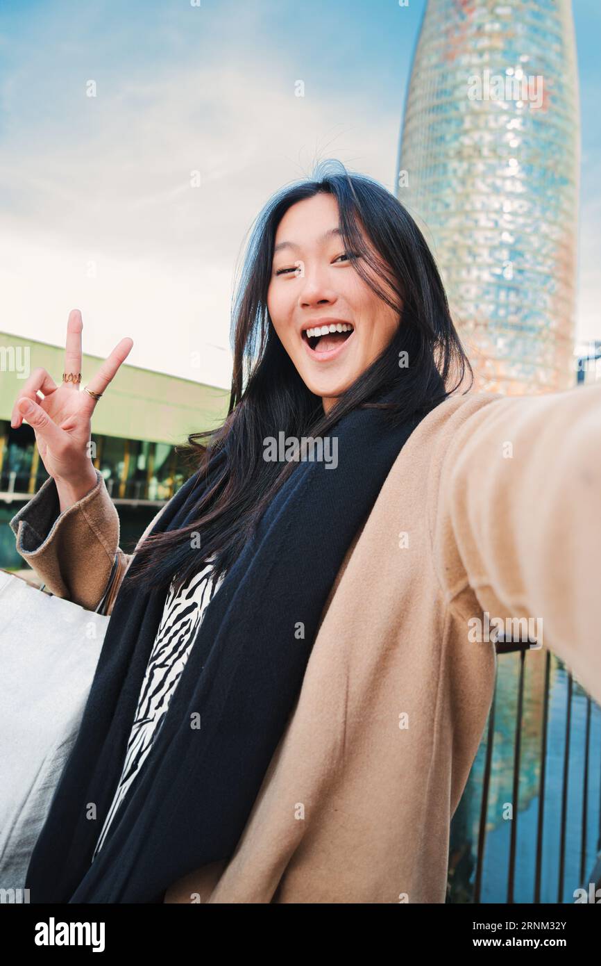 Vertical individual close up portrait of a happy asian young lady ...