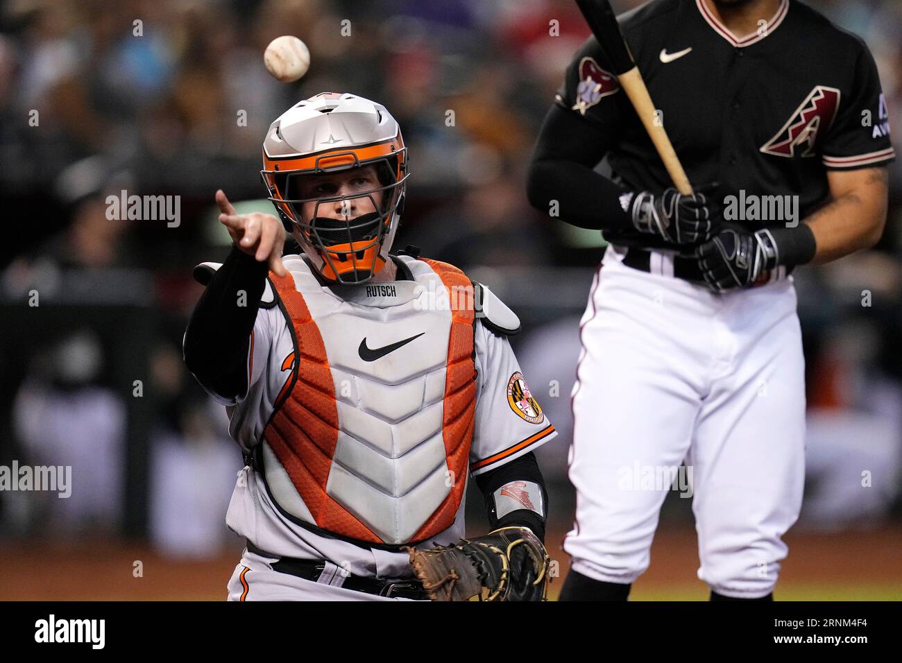Baltimore Orioles catcher Adley Rutschman flips a ball out of play ...