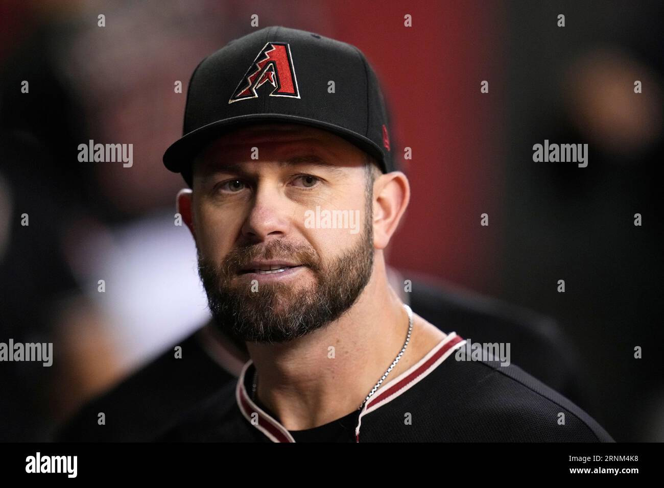 Arizona Diamondbacks third baseman Evan Longoria pauses in the dugout ...