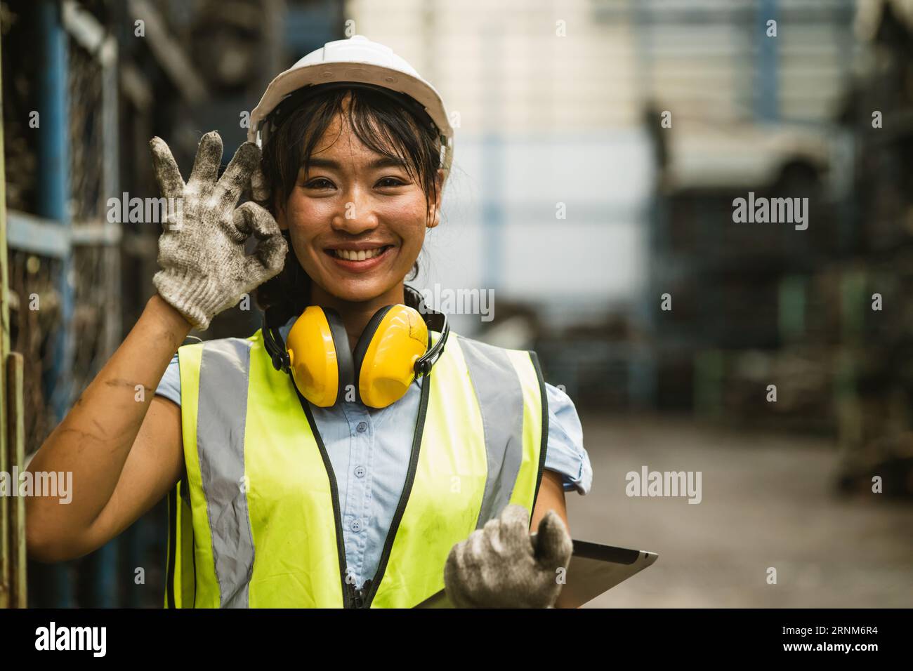 Happy women worker engineer technician employee working dirty workplace ...