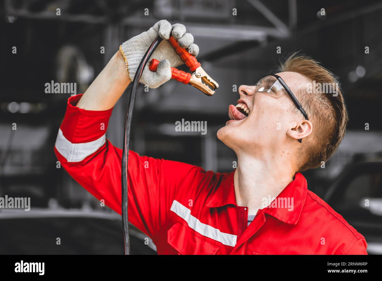 Mechanic male electricity man with charging battery clamps tool clip ...