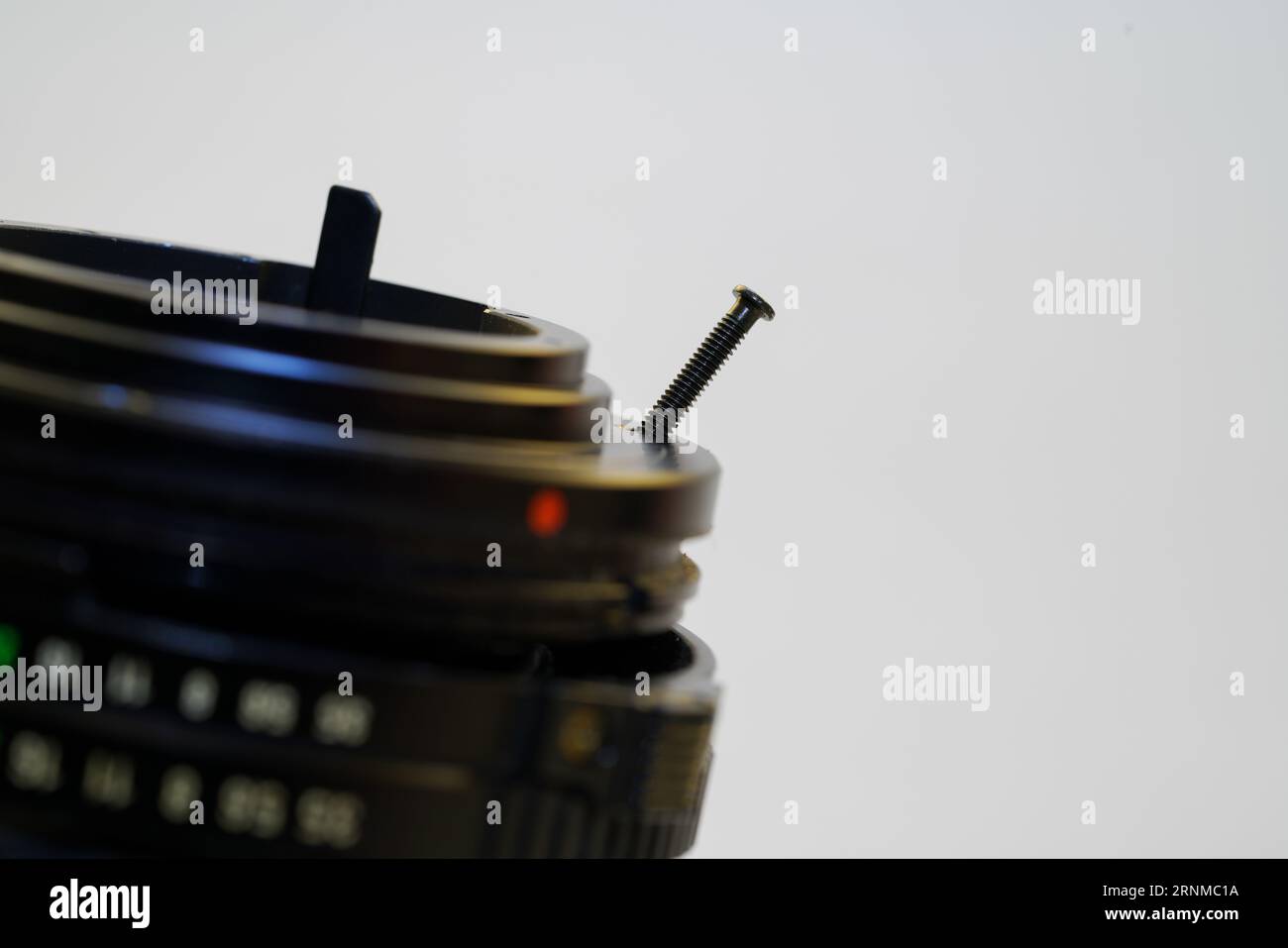 Clean and disassemble the lens for photography into its component parts ...