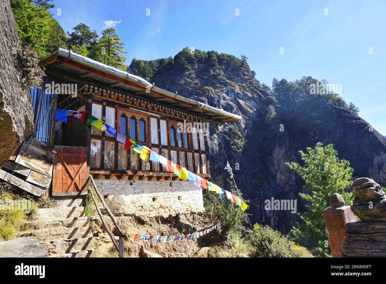 Traditional Bhutanese structure with ornate painted woodwork and arched ...