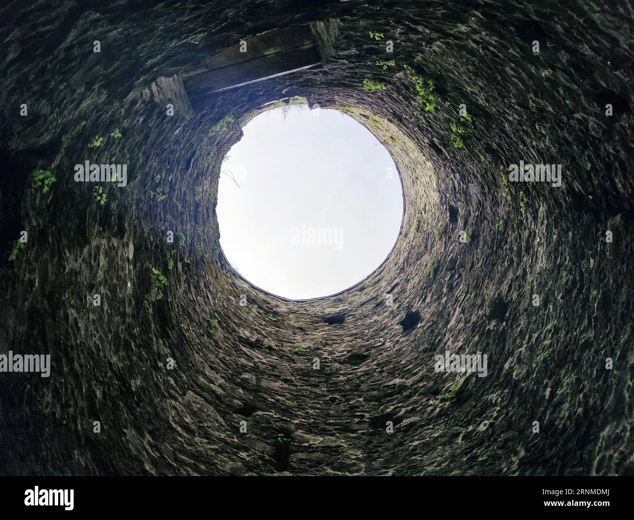 Stone well hole, old construction from inside, fall down in the well ...
