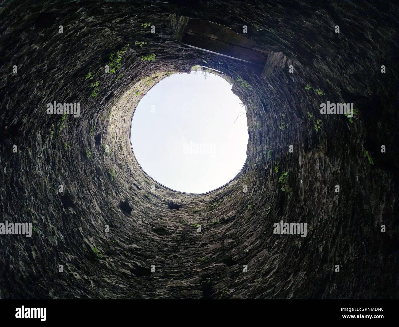 Stone well hole, old construction from inside, fall down in the well ...
