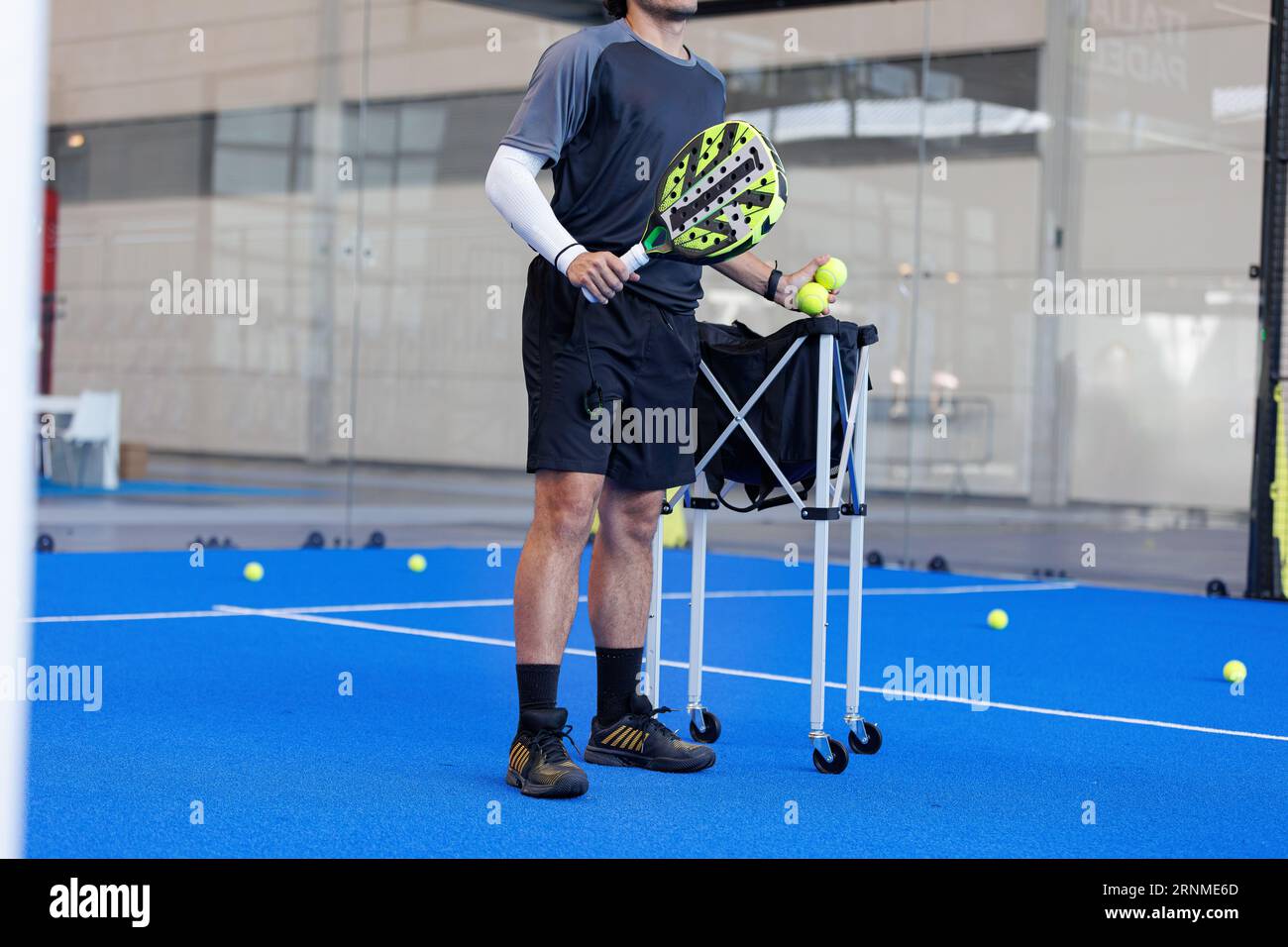 Padel Instructor Teaching the Game Techniques Stock Photo - Alamy