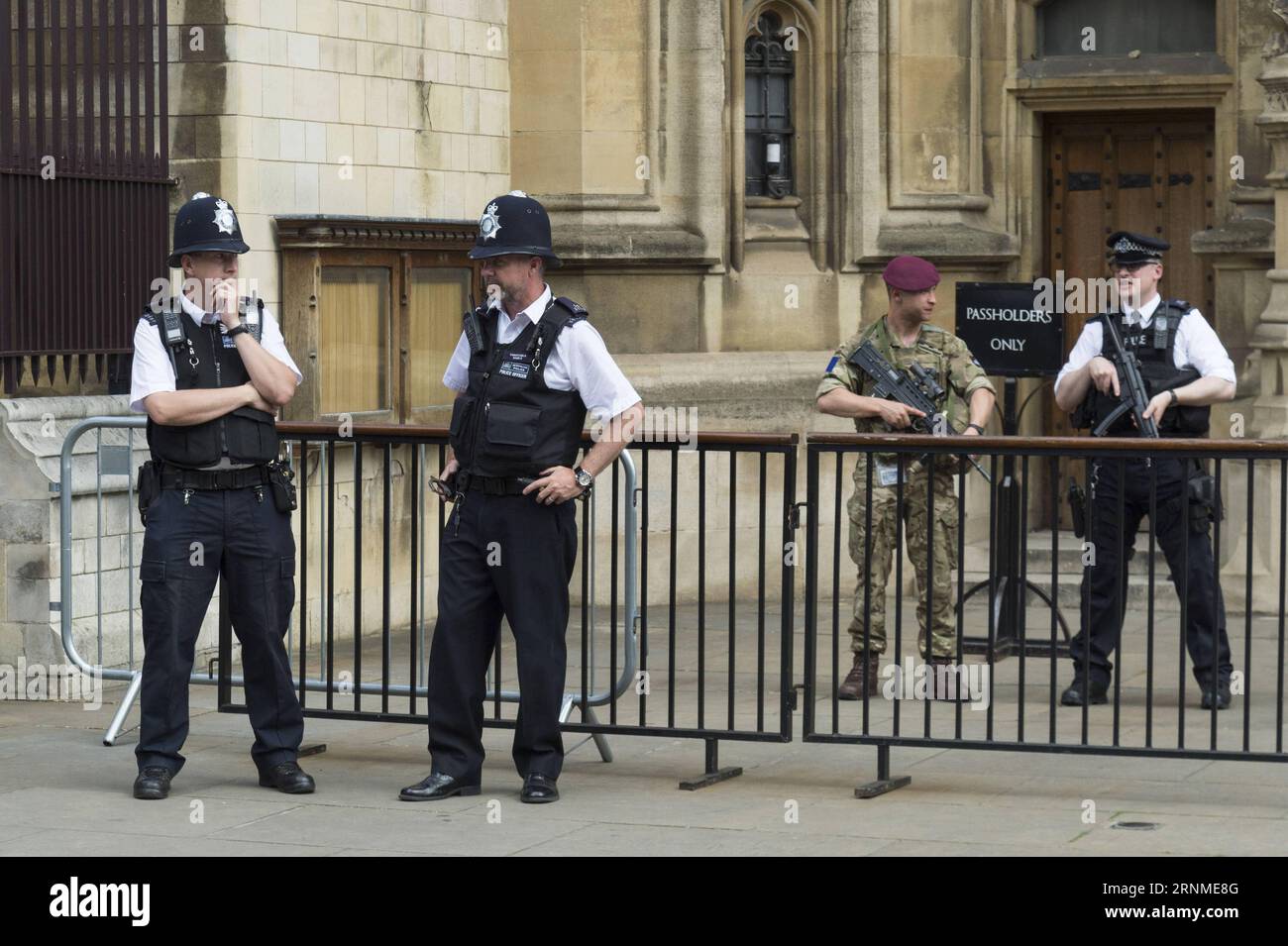 Armed police officers guard houses hi-res stock photography and images ...