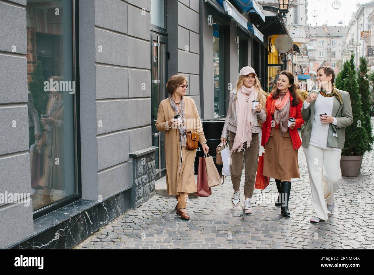 Older women, best friends have fun walking the streets of the city ...