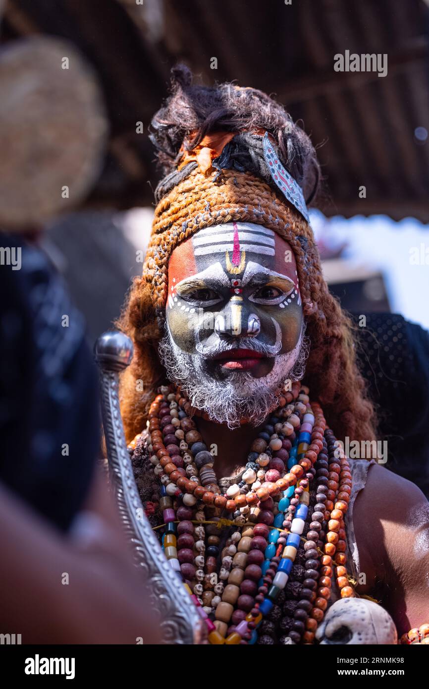 Masan Holi, Portrait of an male artist with painted face act as lord ...