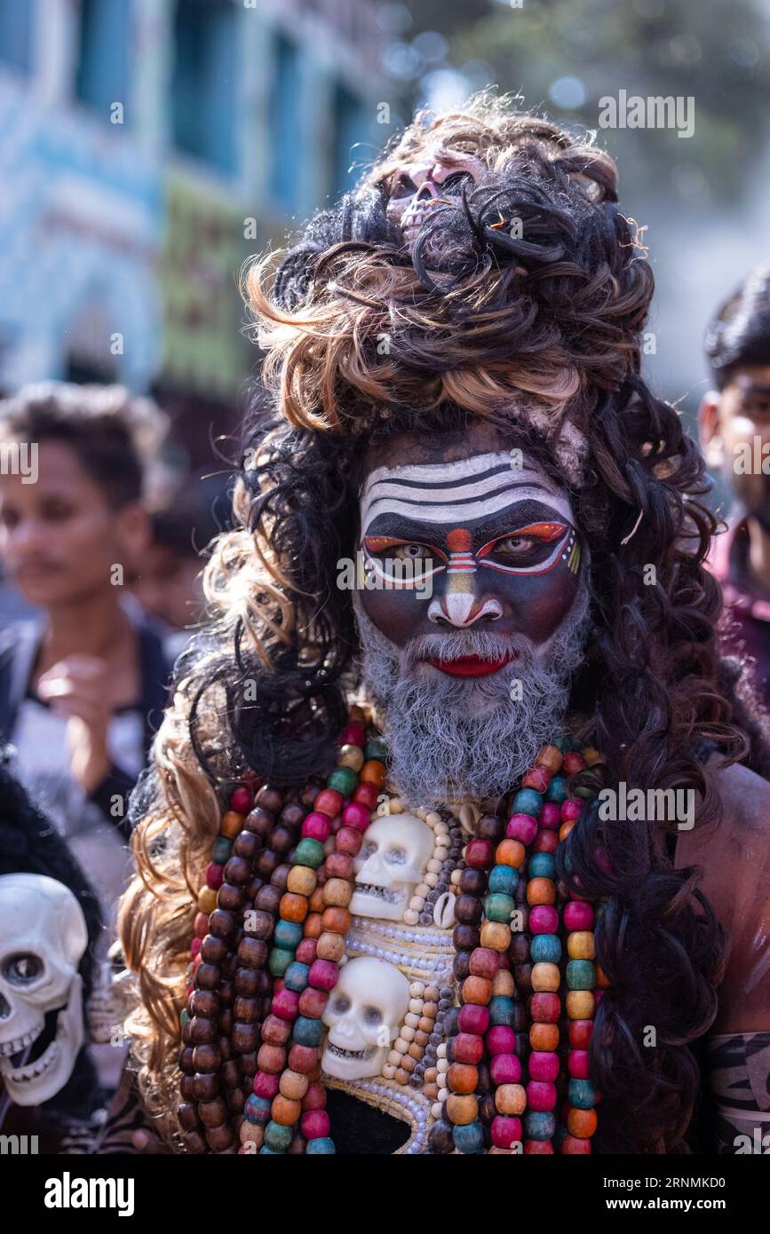 Masan Holi, Portrait of an male artist with painted face act as lord ...