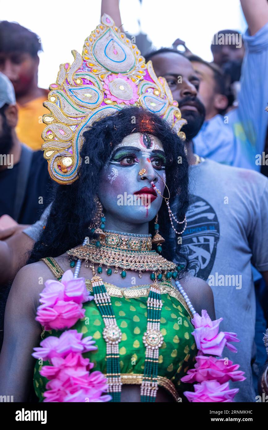 Masan Holi, Portrait of an male artist with painted face act as lord ...
