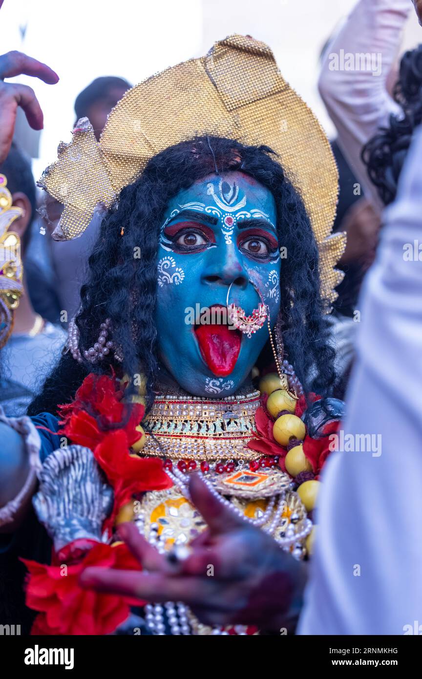Masan Holi, Portrait of an male artist with painted face act as lord ...