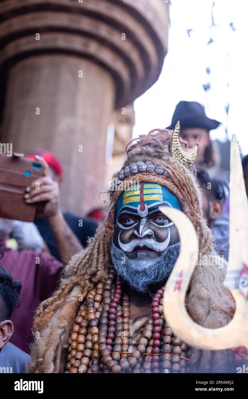 Masan Holi, Portrait of an male artist with painted face act as lord ...