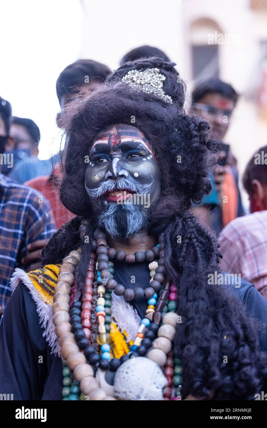 Masan Holi, Portrait of an male artist with painted face act as lord ...