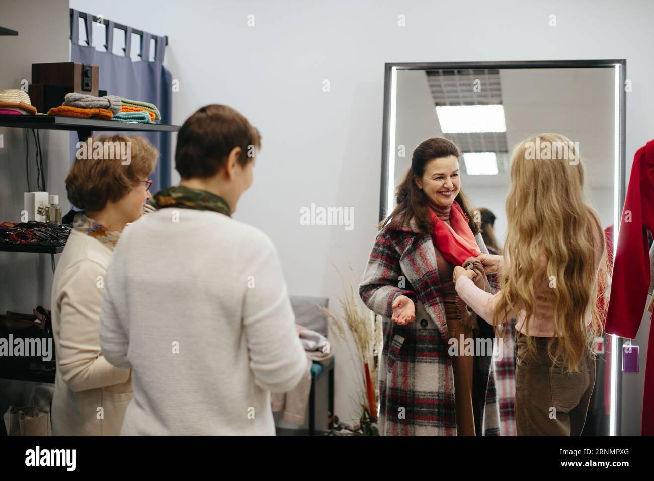 Female friends fitting clothes hi-res stock photography and images - Alamy