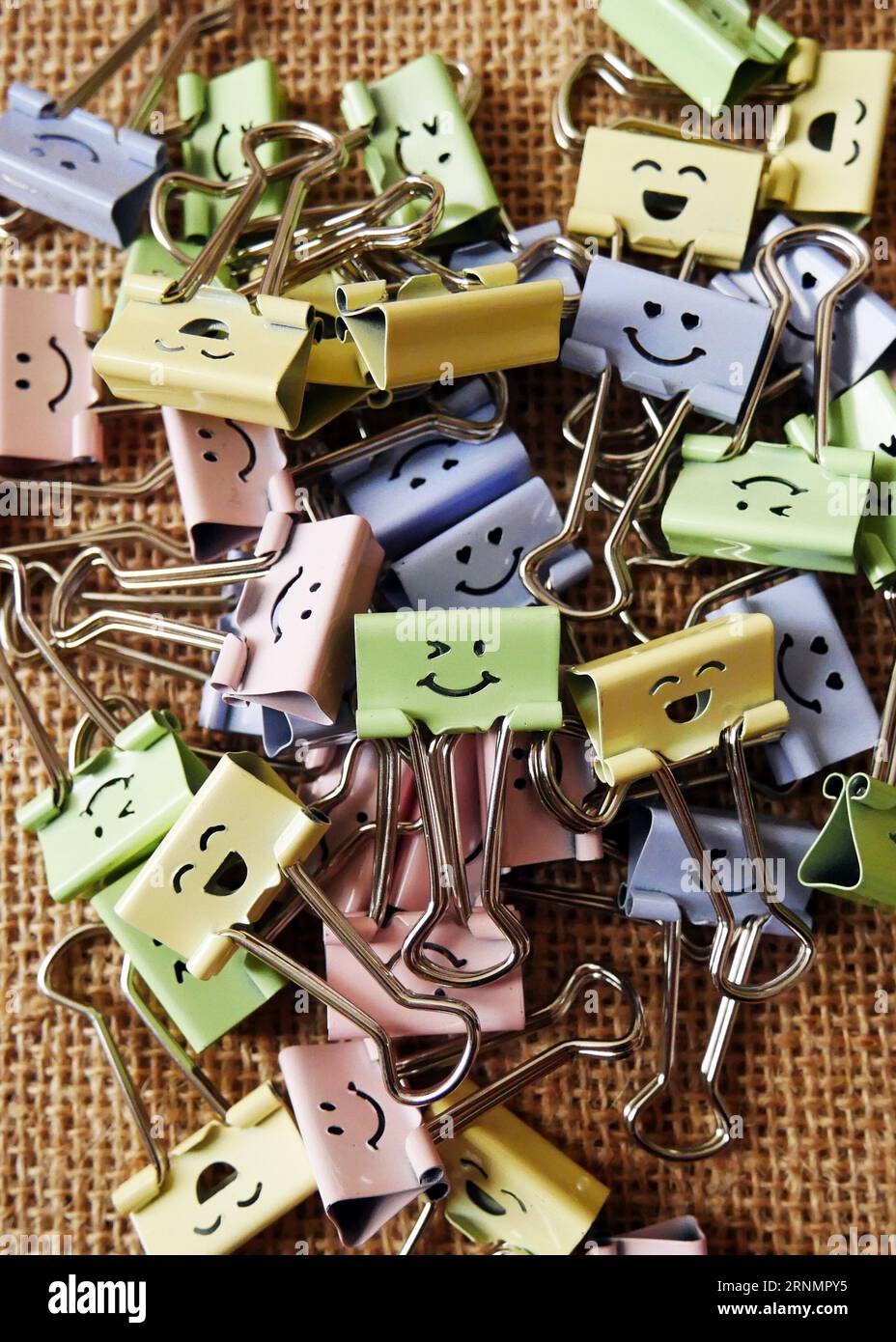 Pastel colored Office Paper Clips, Smiley Binder Clips, and Pencils on ...
