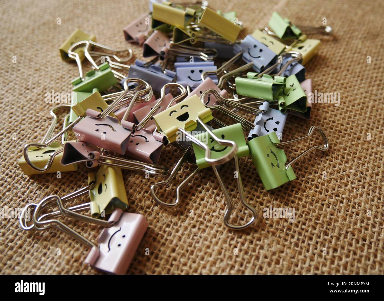Pastel colored Office Paper Clips, Smiley Binder Clips, and Pencils on ...