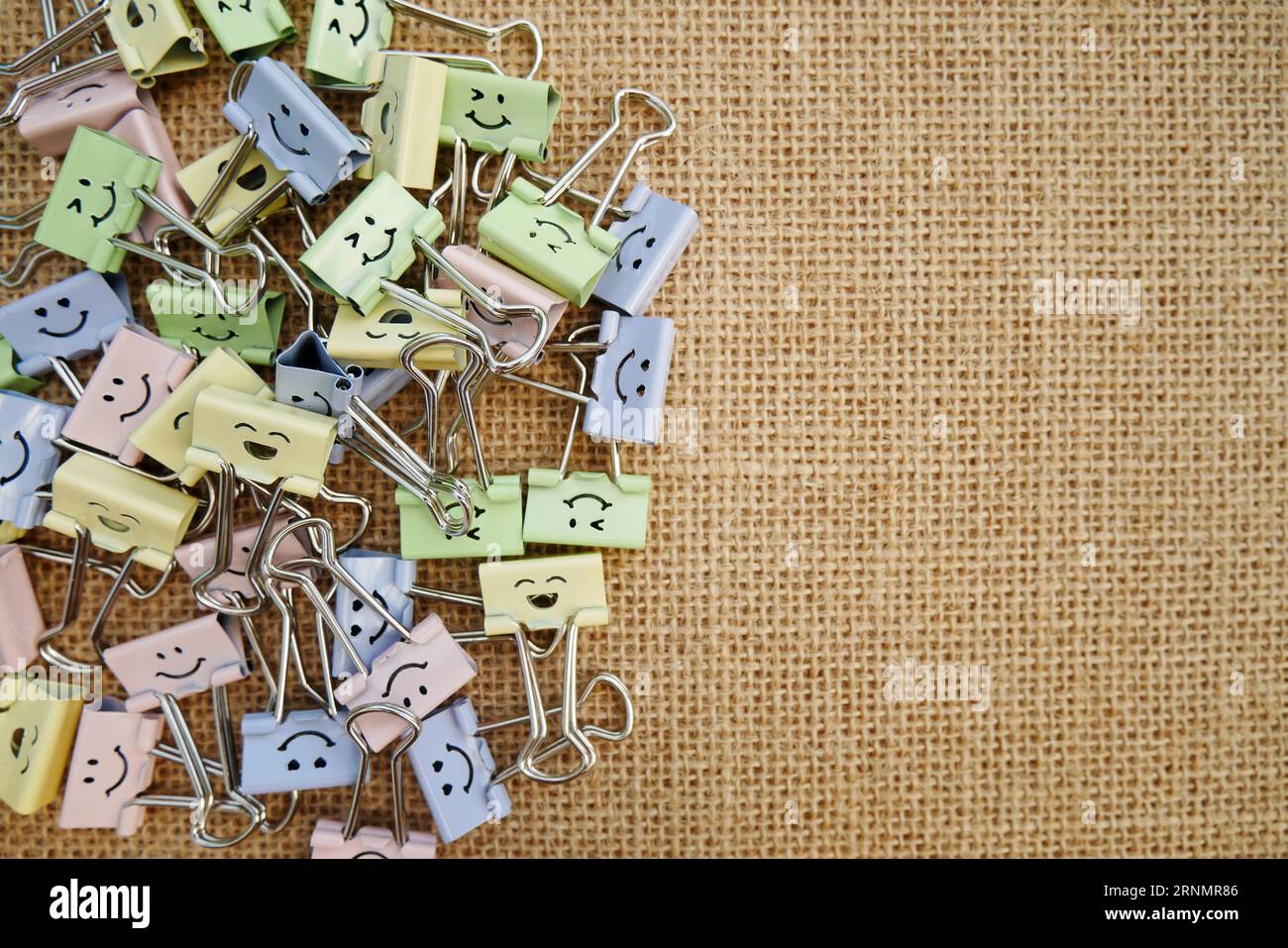 Pastel colored Office Paper Clips, Smiley Binder Clips, and Pencils on ...