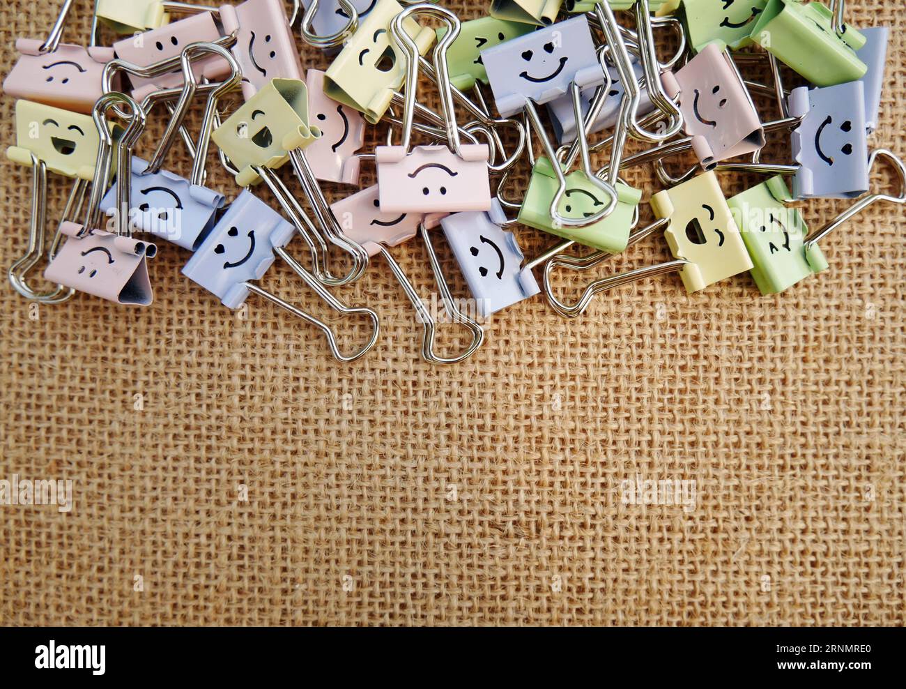Pastel colored Office Paper Clips, Smiley Binder Clips, and Pencils on ...
