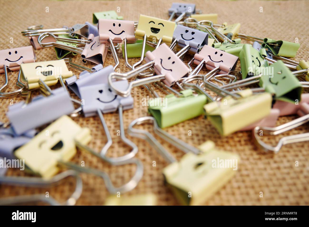 Pastel colored Office Paper Clips, Smiley Binder Clips, and Pencils on ...