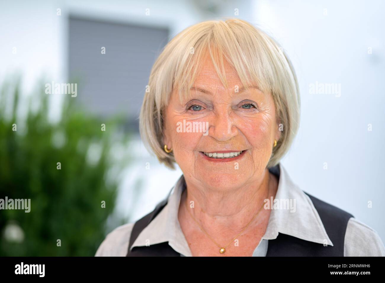 Frontal portrait of a very attractive older woman in her eighties ...