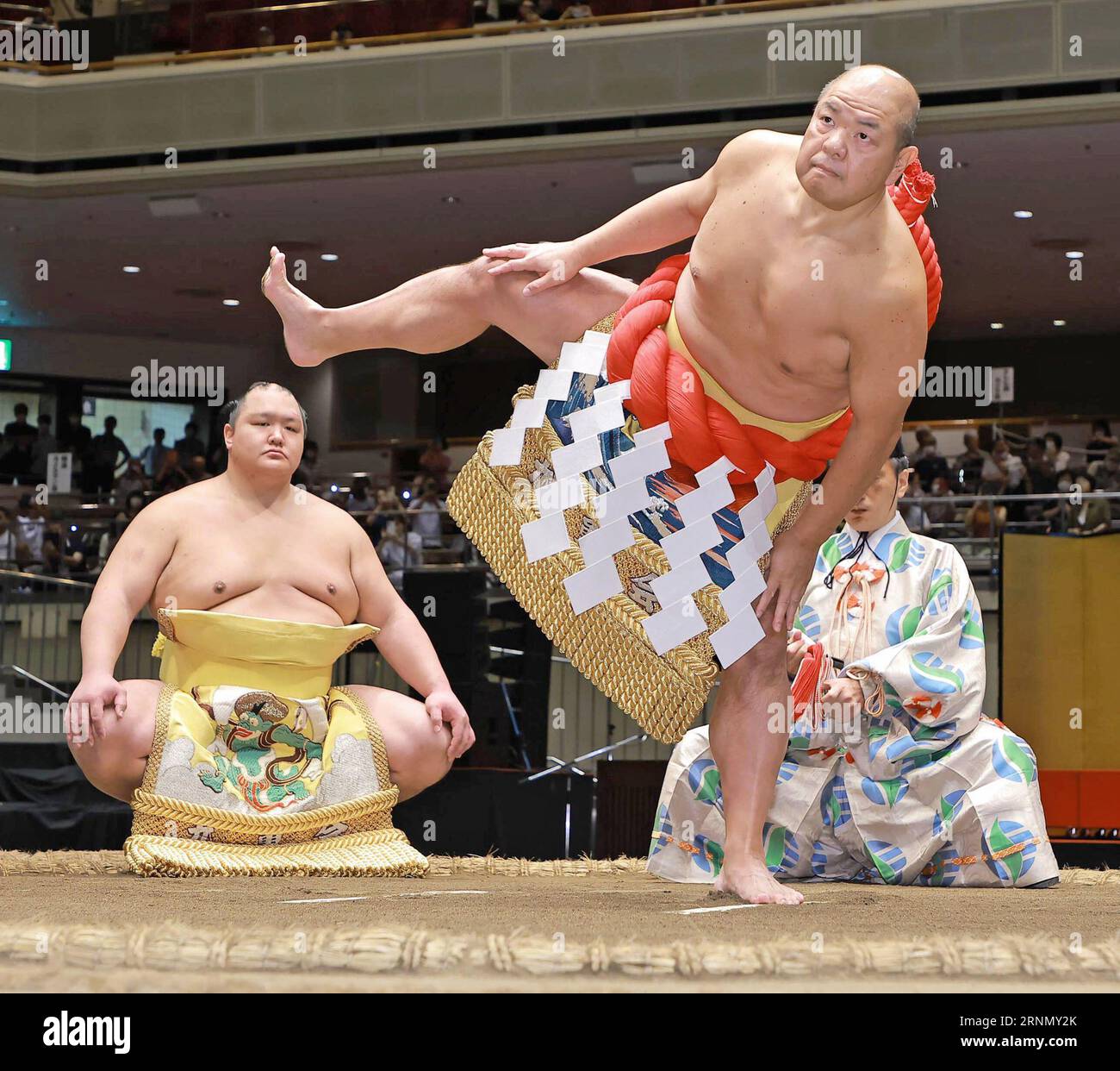 Japan Sumo Association head Hakkaku performs a ring-entering ceremony ...