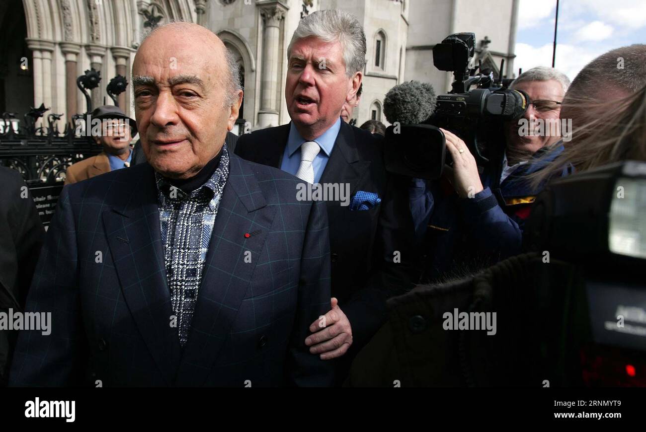 Mohamed al fayed left with michael cole second left hi-res stock ...