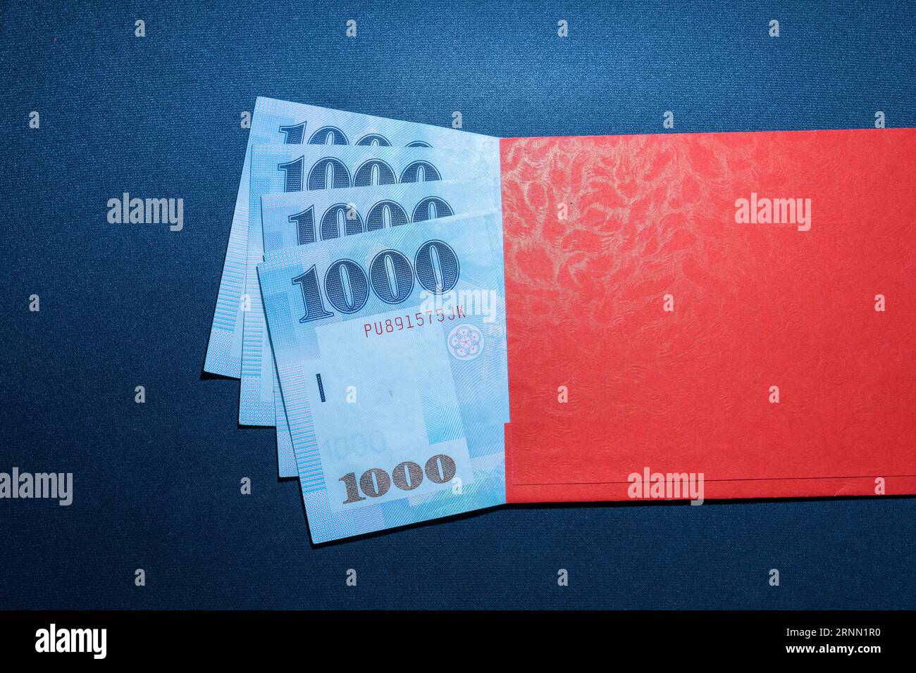 Banknotes of 1000 taiwan new dollar in red anvelope Stock Photo - Alamy