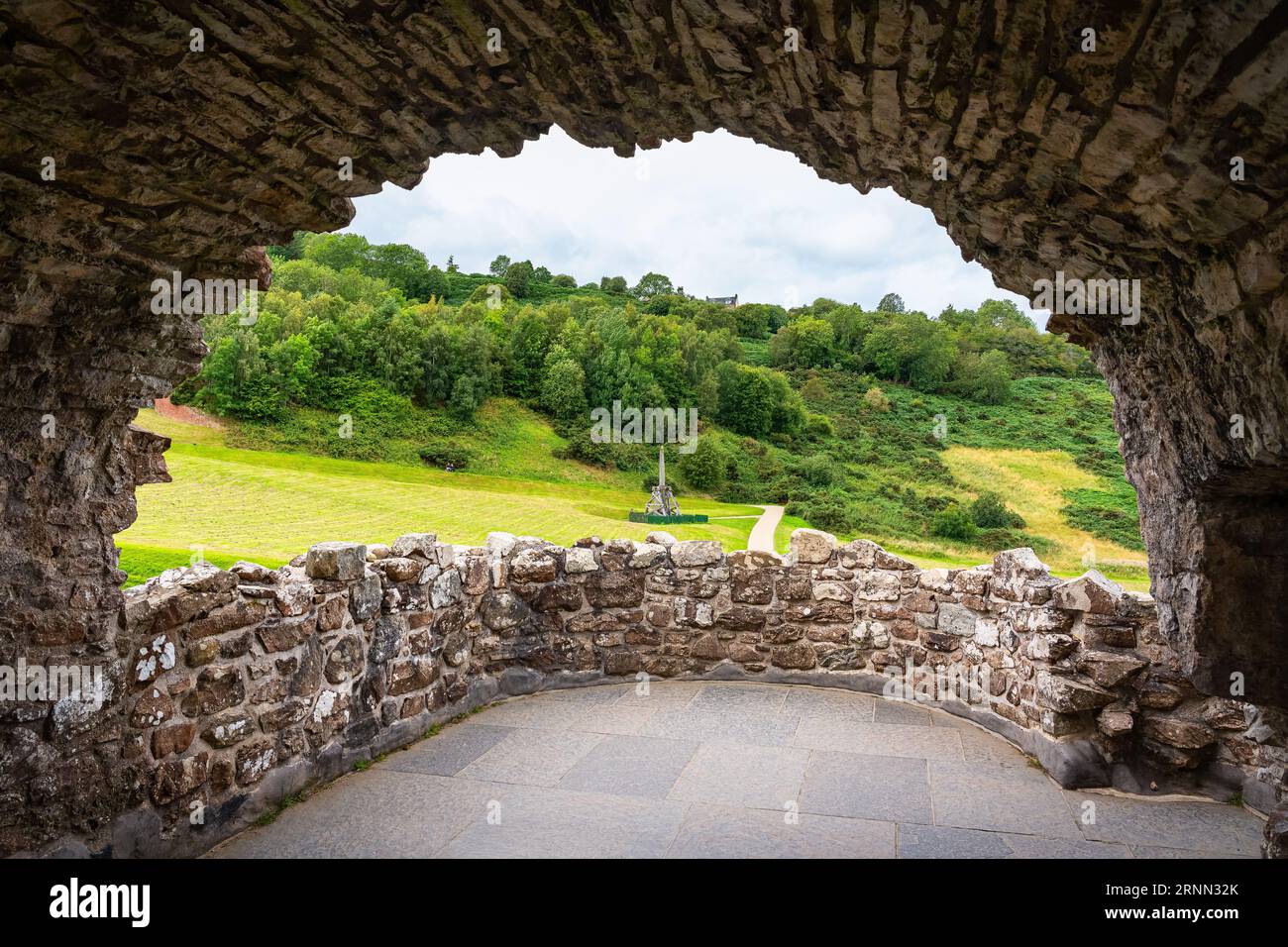 Stone arch of medieval Urquhart Castle on the shore of Loch Ness ...