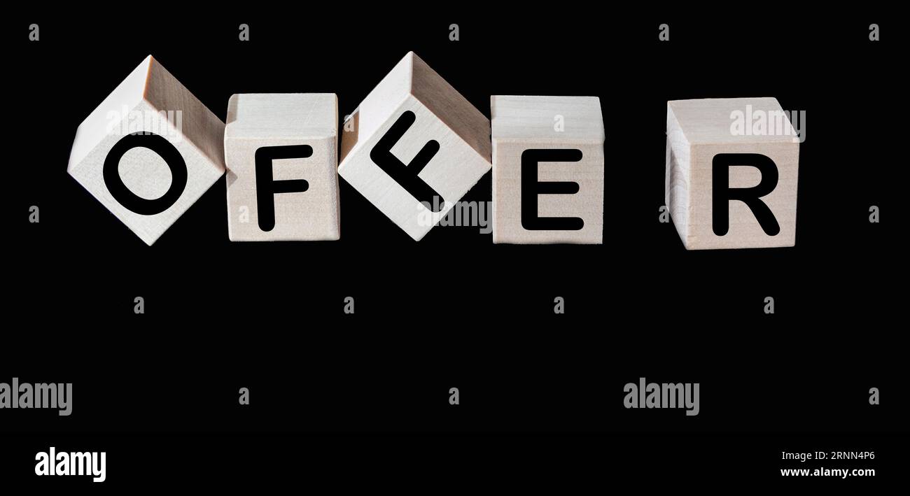Offer symbol. Wooden cubes with the word Offer on a black background ...