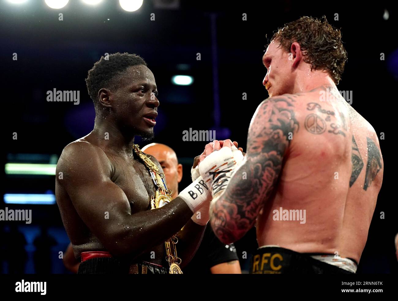 Samuel Antwi (left) shakes hands with Mason Cartwright after winning ...