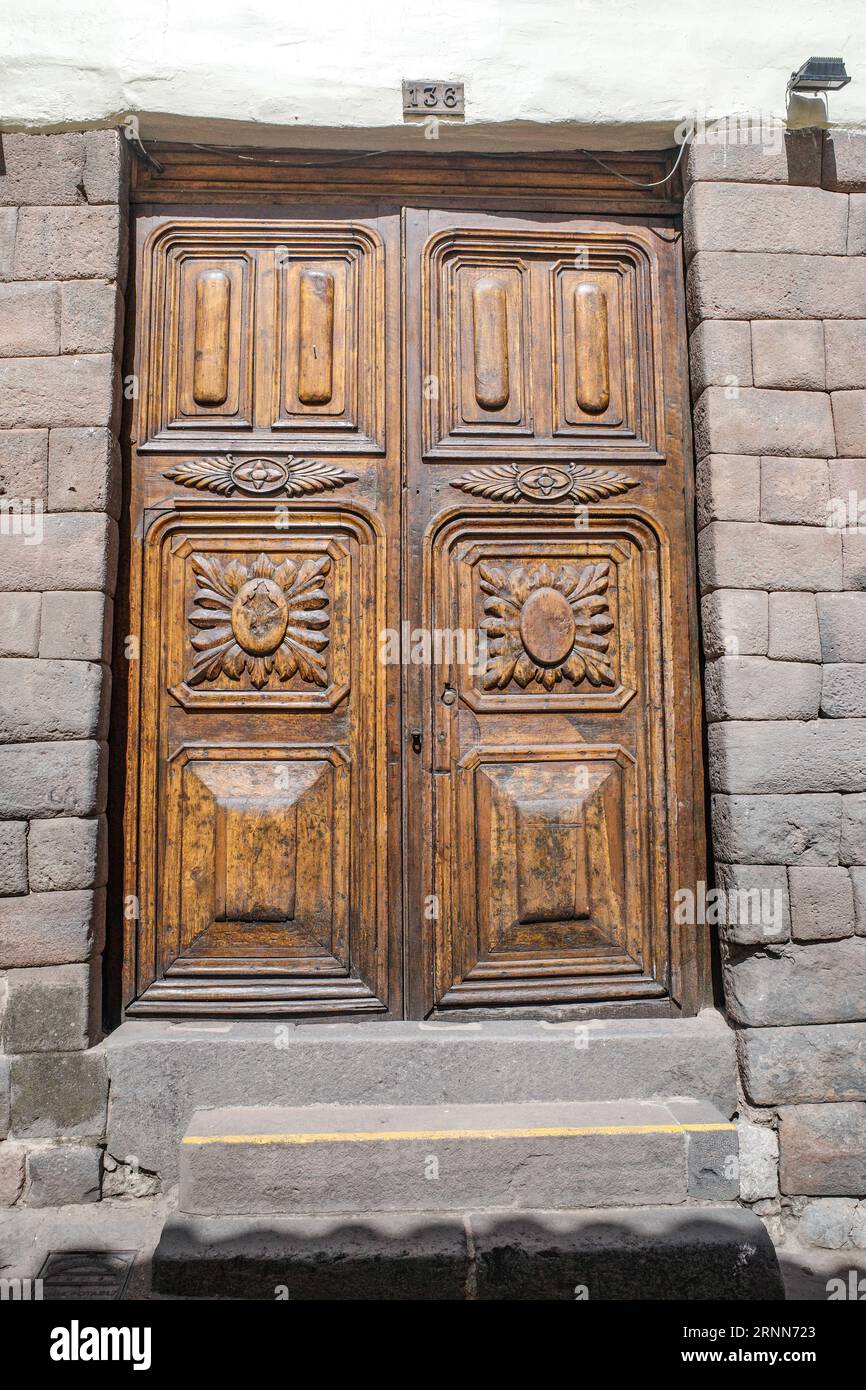 Cusco, Peru - Dec 4, 2022: Hand carved wooden door on a building in ...