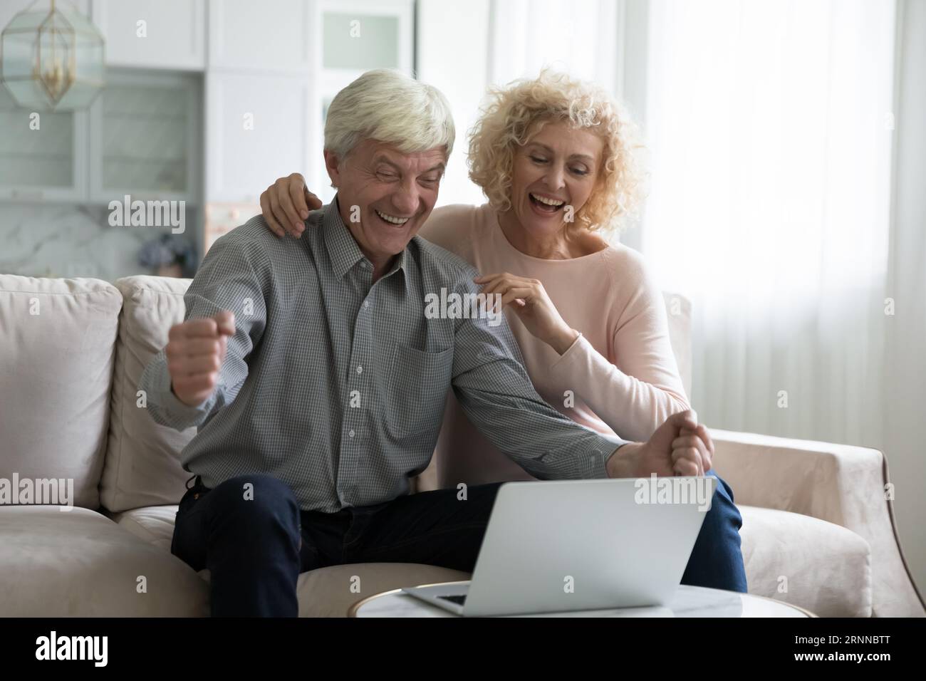 Happy excited mature old married couple celebrating win Stock Photo - Alamy