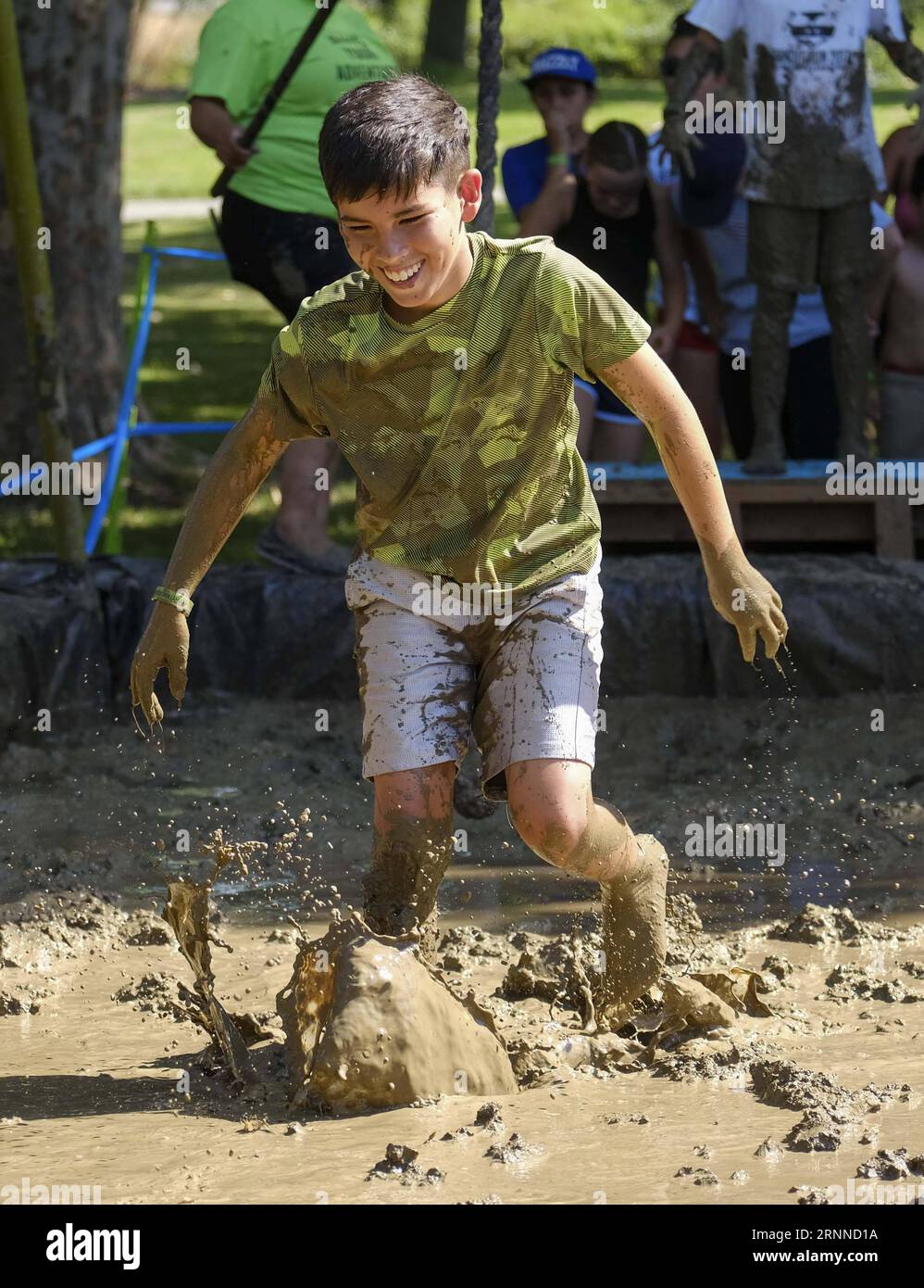 (170709) -- LOS ANGELES, July 9, 2017 -- A boy crosses the mud pit ...