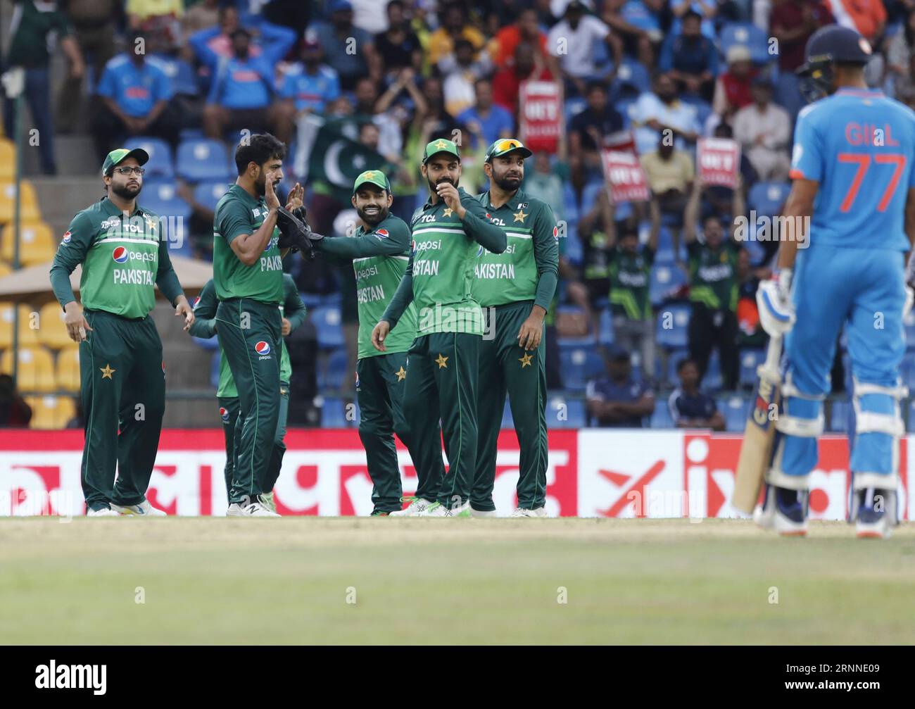 Pakistan's Haris Rauf celebrates with teammates the dismissal of India ...
