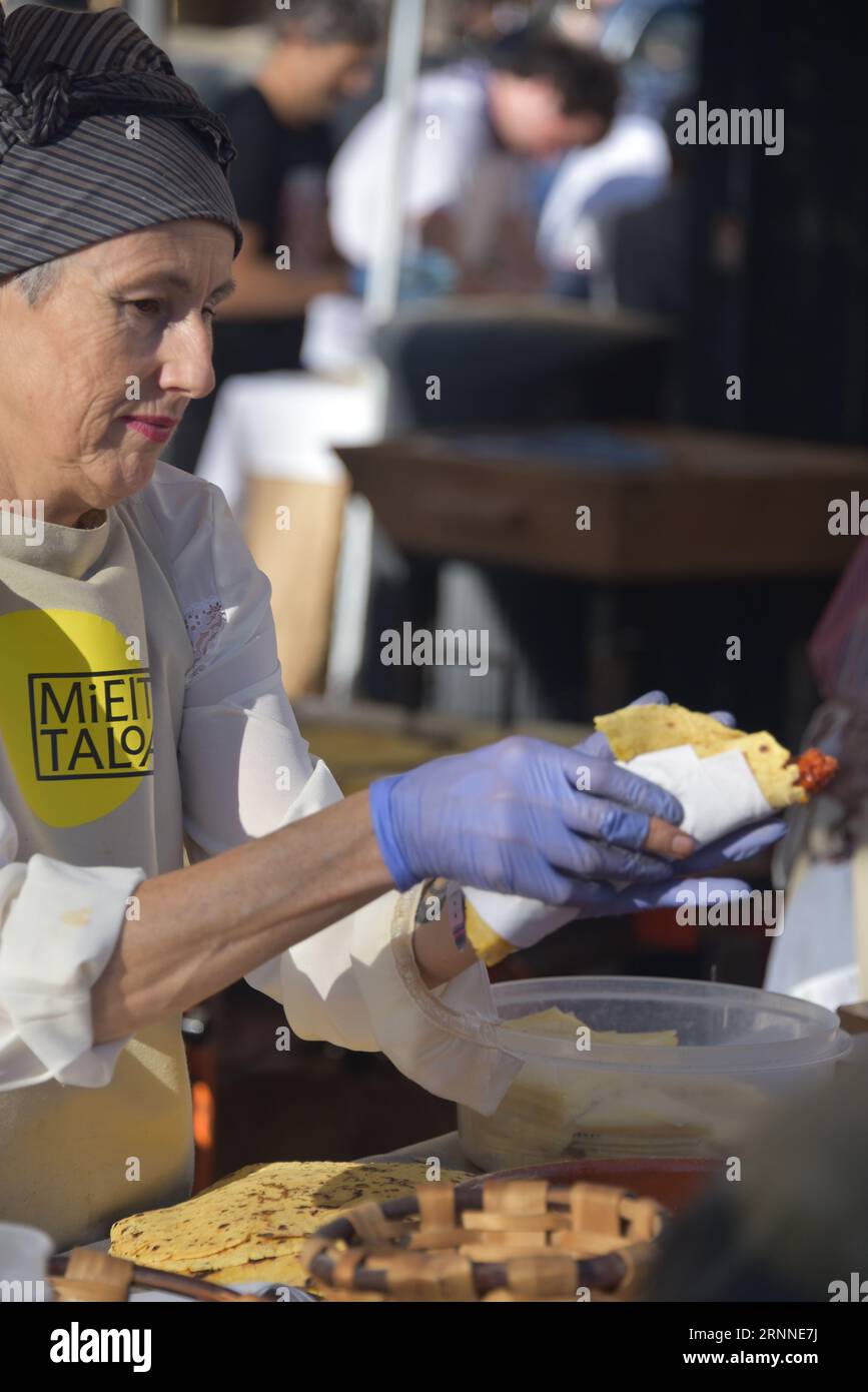 San Sebastian, Spain - December 21, 2022: Basque farmers roasting ...