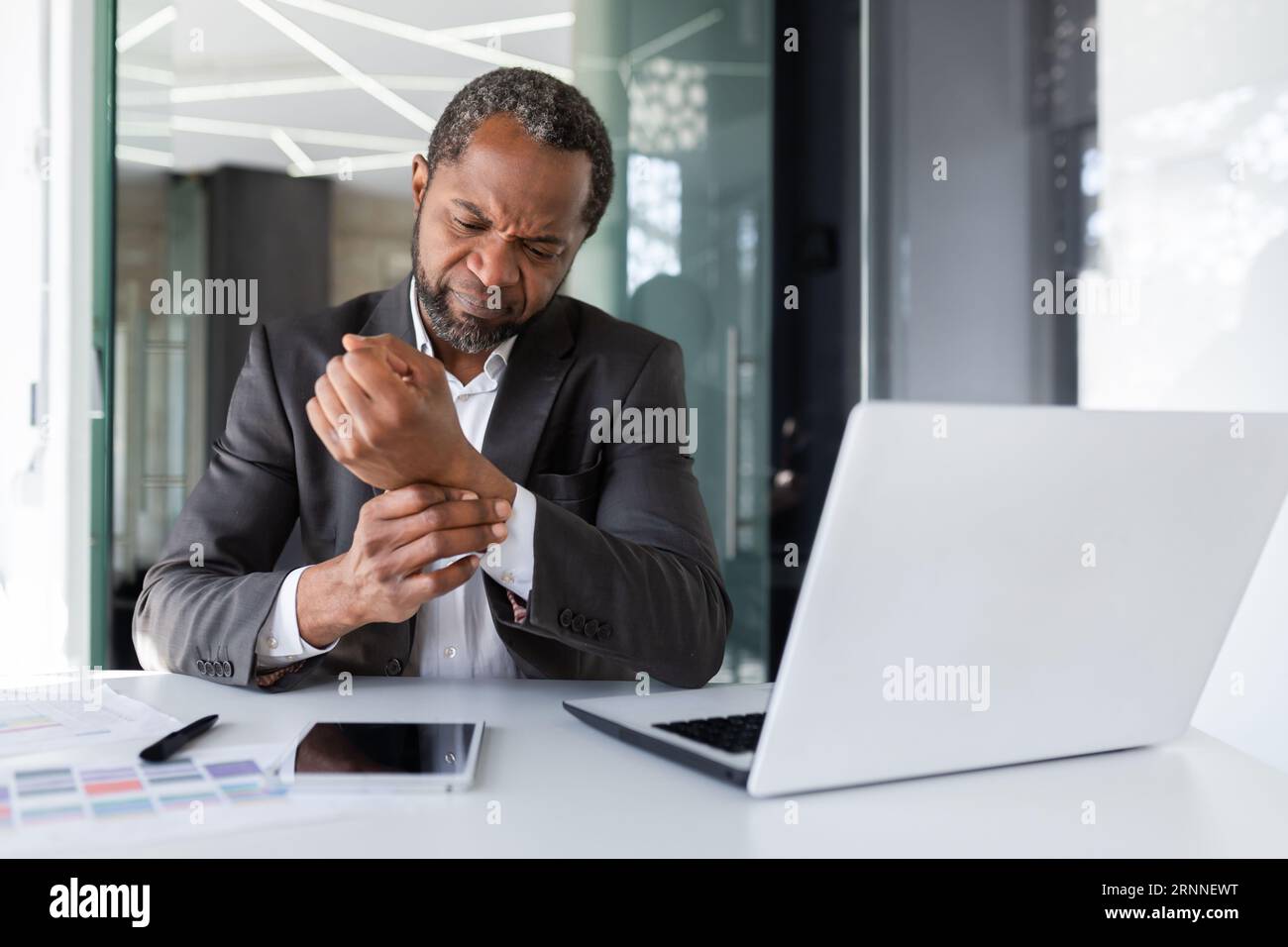 African businessman wrist pain working hi-res stock photography and ...