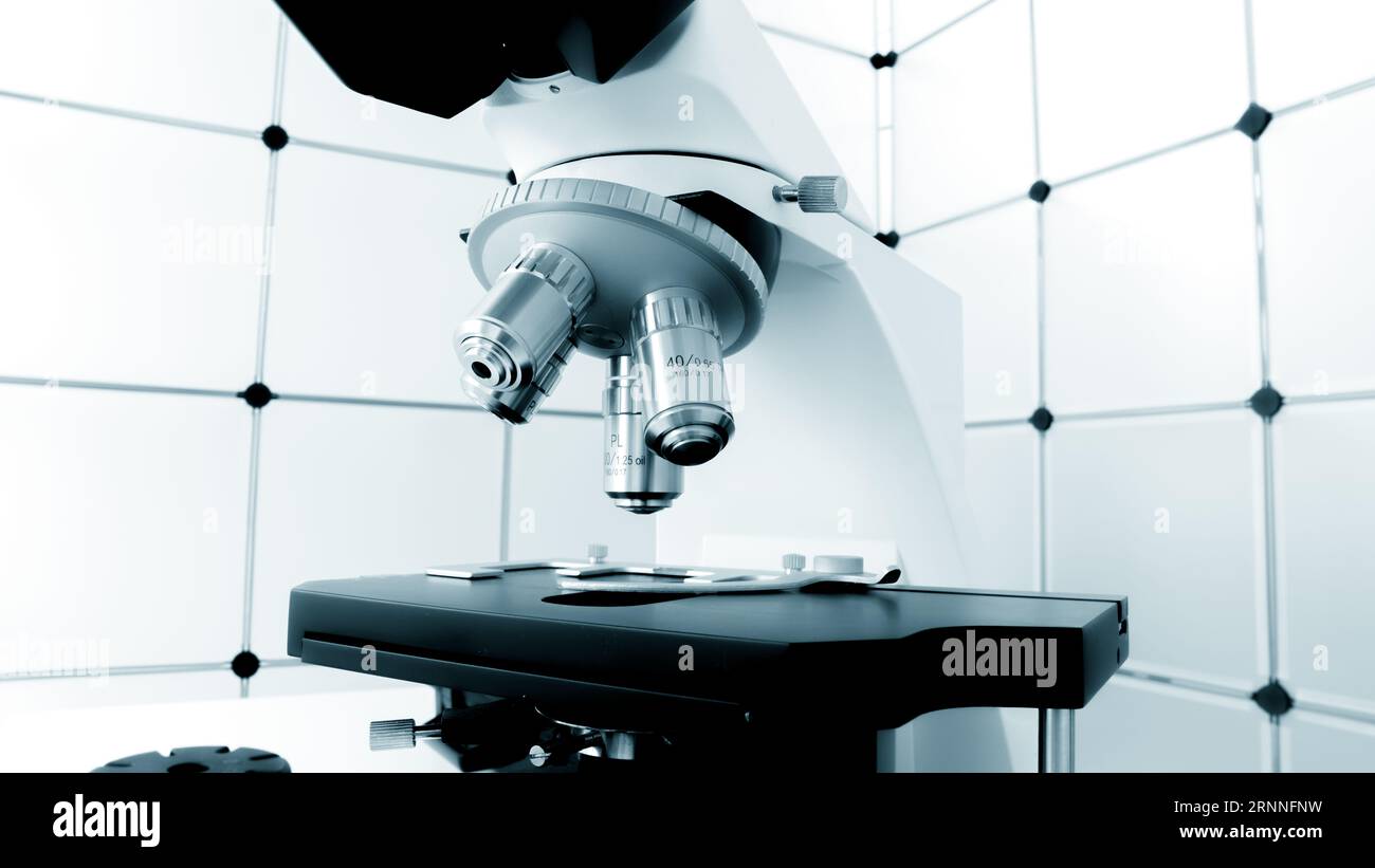 research optical microscope in blue tones in the scientific laboratory ...