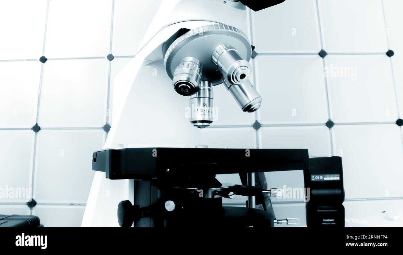 research optical microscope in blue tones in the scientific laboratory ...