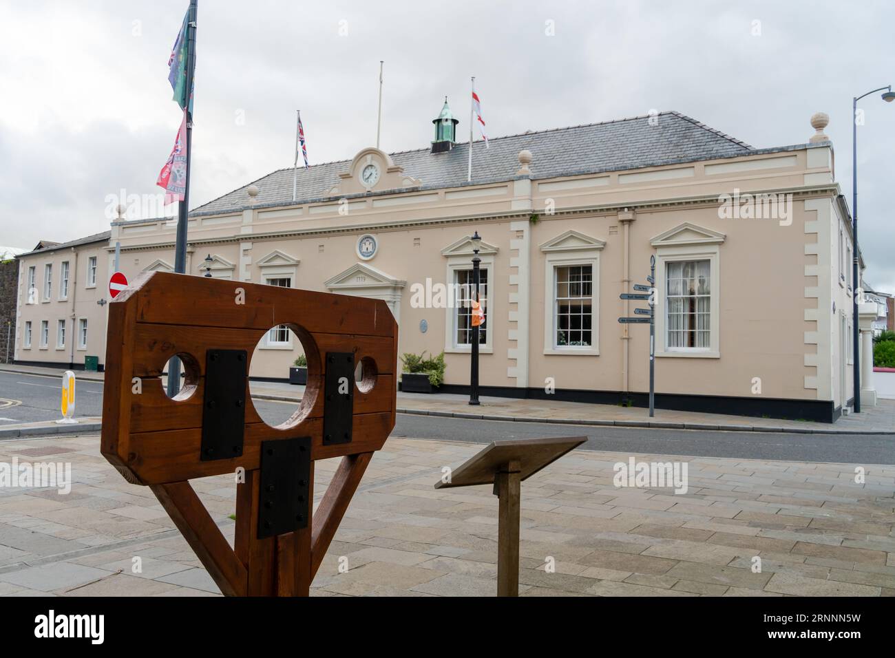 A view of the Town Hall including the replica stocks across the street ...