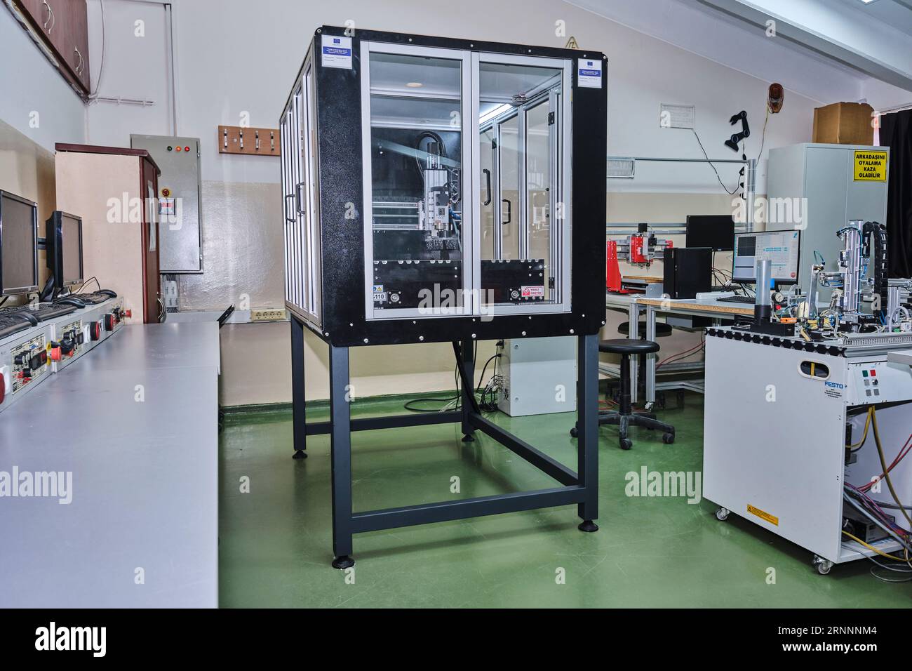 Big 3d printing machine in a workshop. 3D printing machine on a stand ...