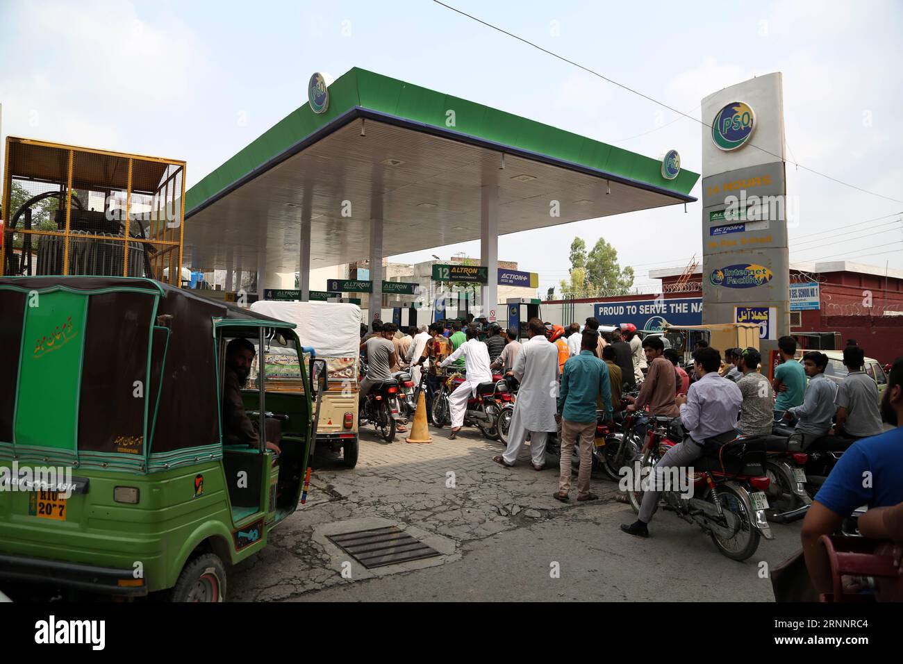 (170726) -- RAWALPINDI, July 26, 2017 -- People line up at a fuel ...
