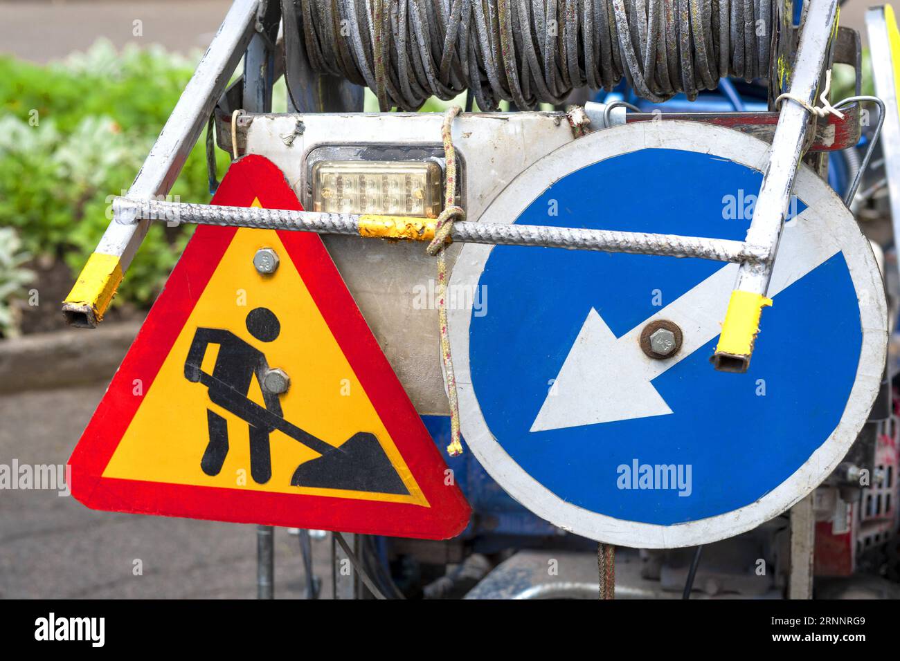 Road signs and the traffic light . Roadworks, road signs in a highway ...