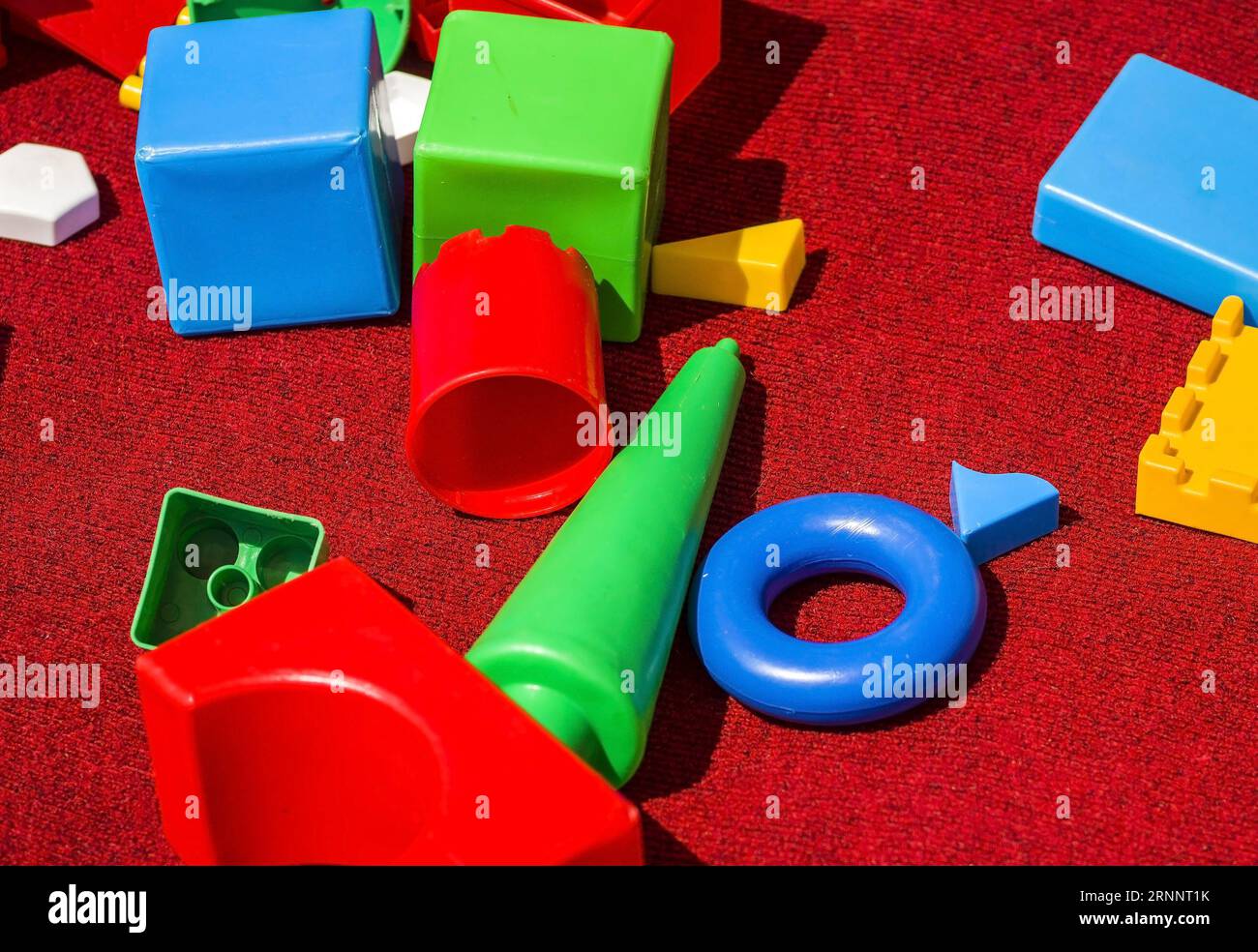 Children's color toys are scattered on a background. Copyspace. A game ...