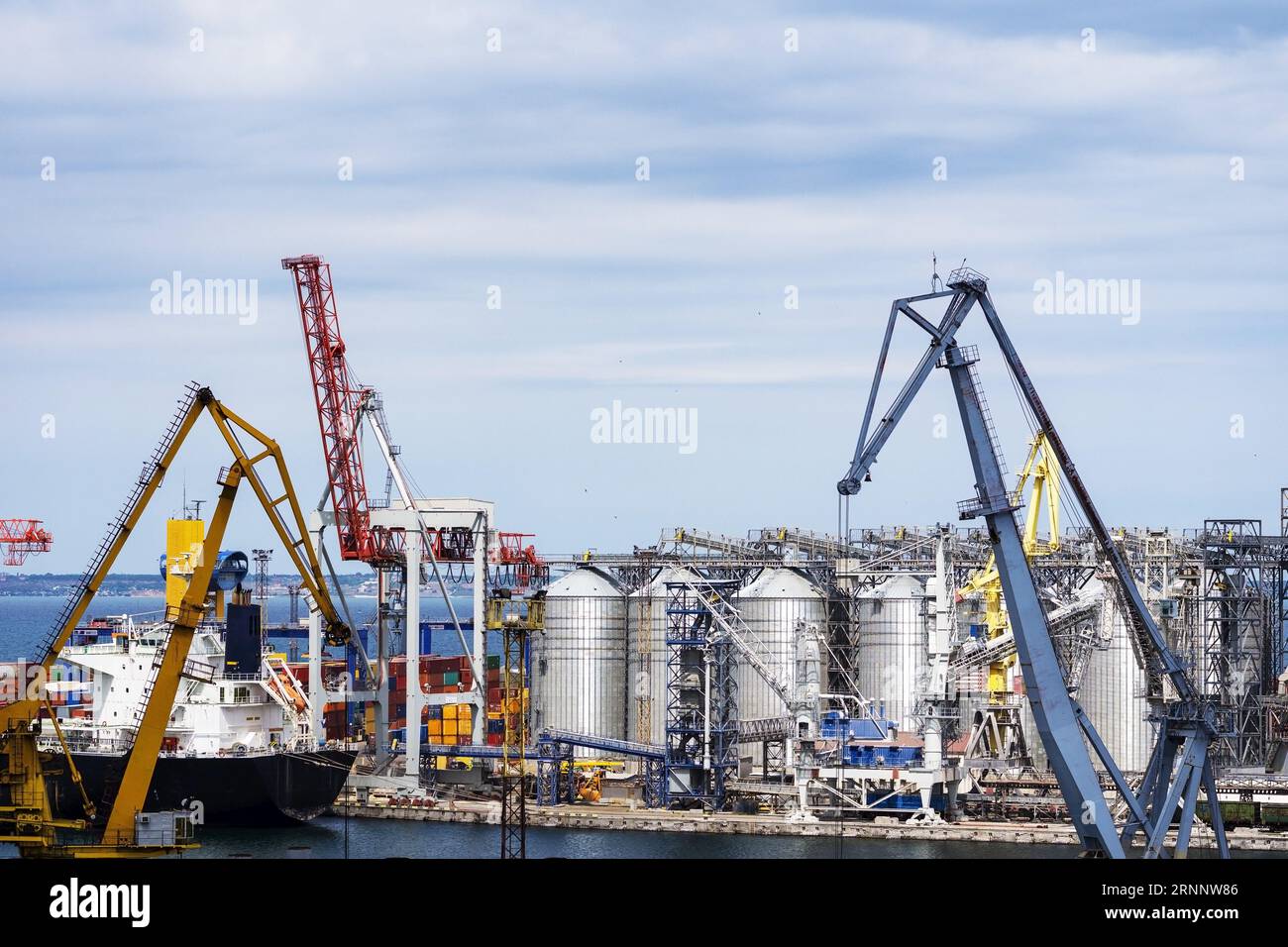 Port Cranes on a Pier of Seaport. Industrial freight.Container terminal ...