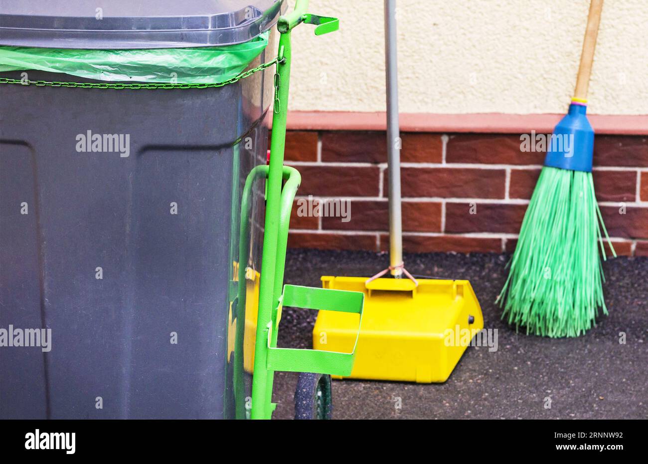 Broom and scoop for cleaning of garbage on the street. The concept ...