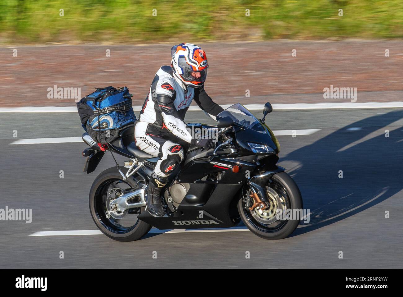 Honda CBR motorcycle travelling at speed on the M6 motorway in Greater ...